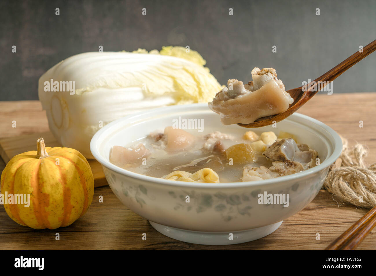 Pig's hoof soup, soup with nutrition with wood grain background Stock ...