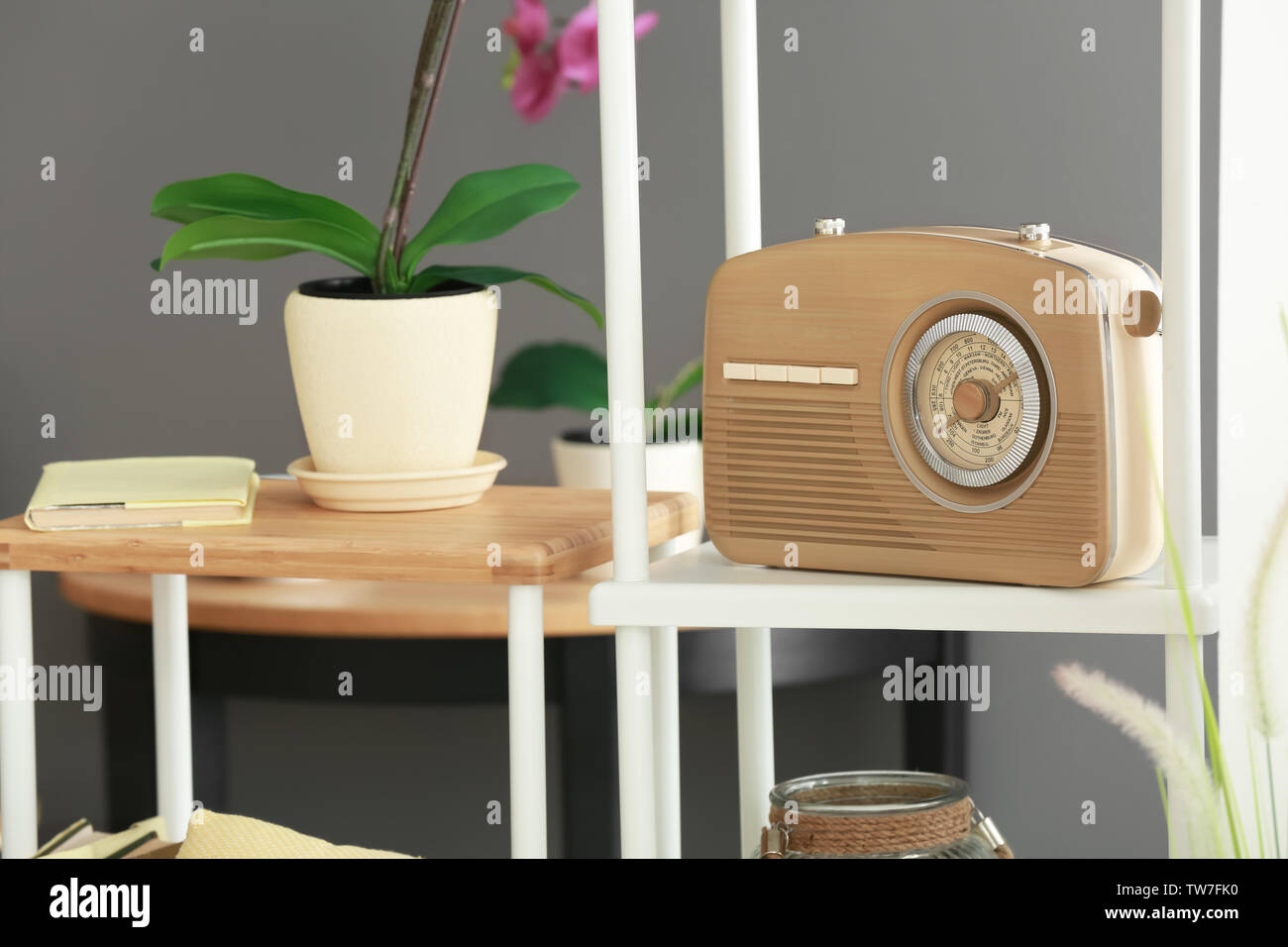 Modern radio receiver on shelf in room Stock Photo - Alamy