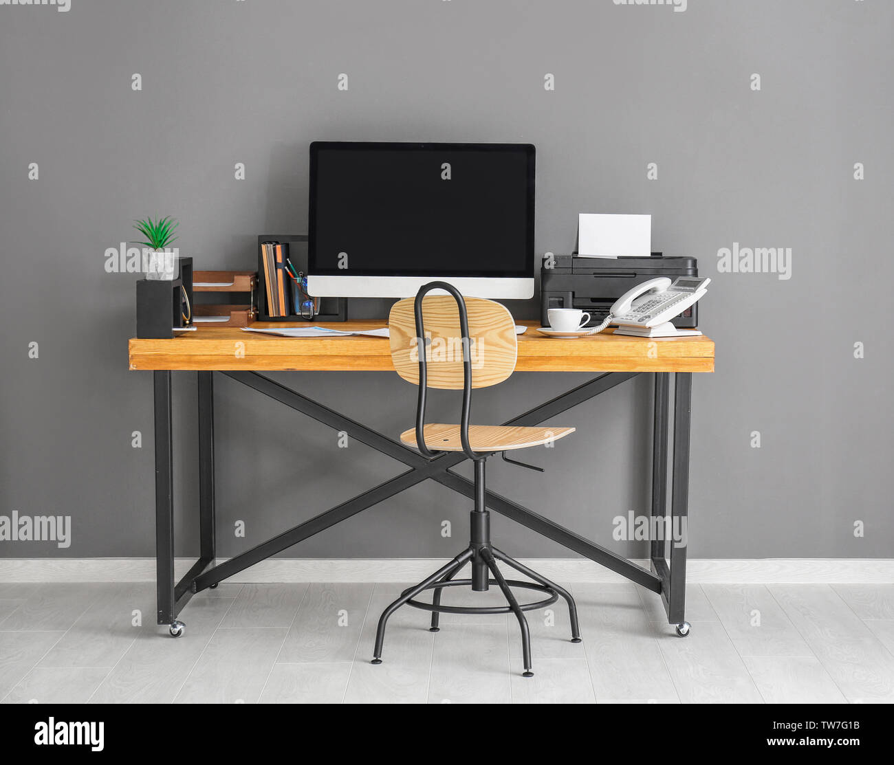 Comfortable workplace with computer monitor on table in office Stock ...