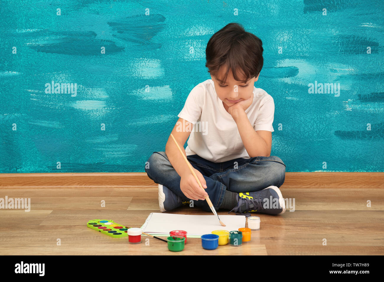 Cute little boy painting at home Stock Photo - Alamy