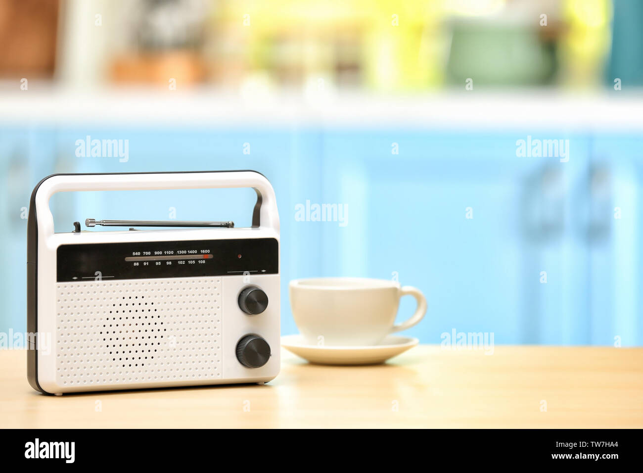Stylish radio receiver on kitchen table Stock Photo - Alamy