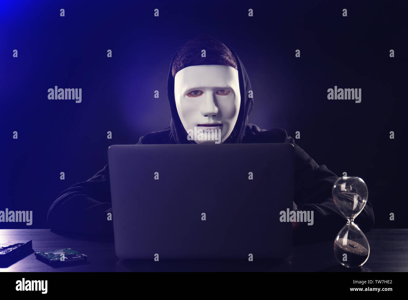 Hacking computer masked data hi-res stock photography and images - Alamy