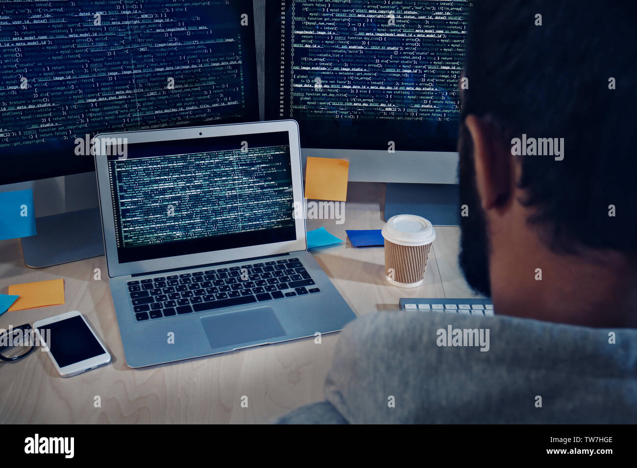 Man hacking server in dark room Stock Photo - Alamy