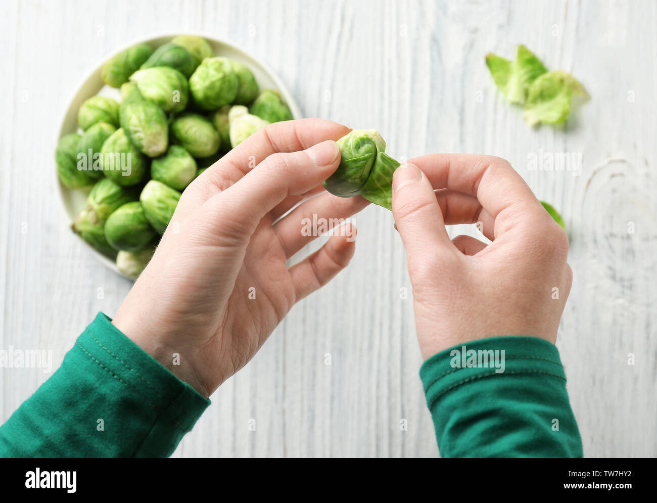 Brussels sprouts in hands hi-res stock photography and images - Alamy