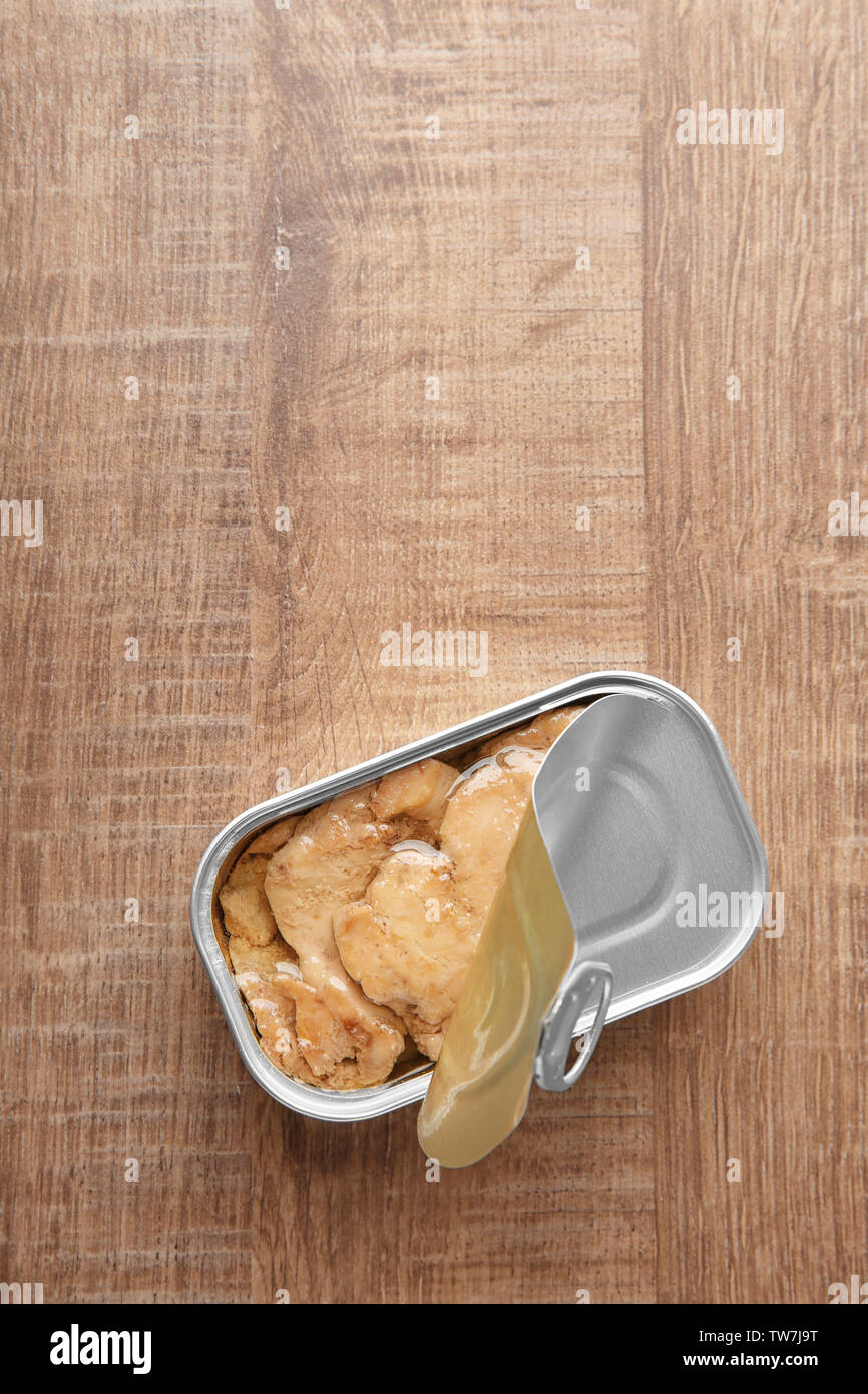 Open tin container with cod liver on wooden background Stock Photo - Alamy
