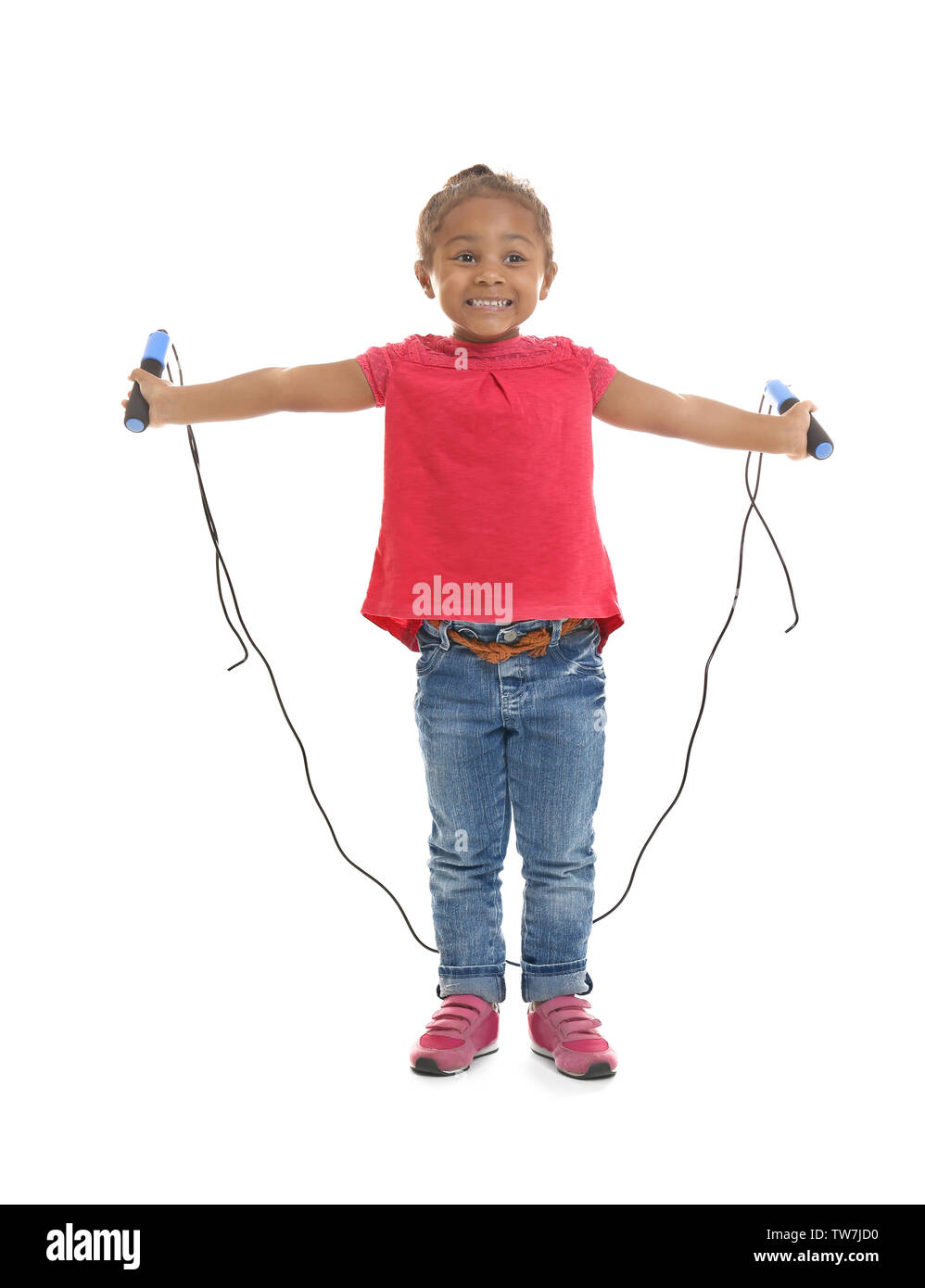 Cute African American girl skipping rope on white background Stock ...
