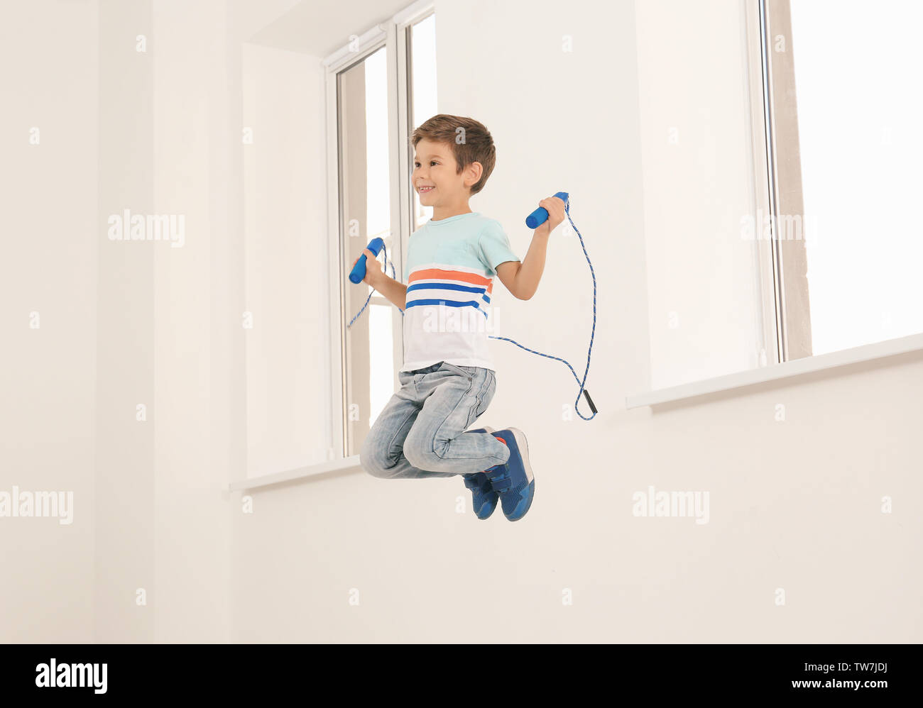 Boy skipping in the street hi-res stock photography and images - Alamy