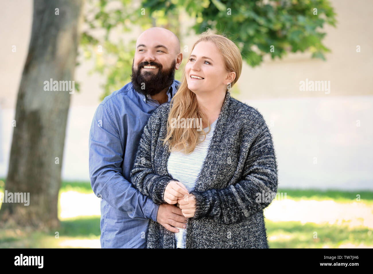 Romantic overweight couple in park Stock Photo - Alamy