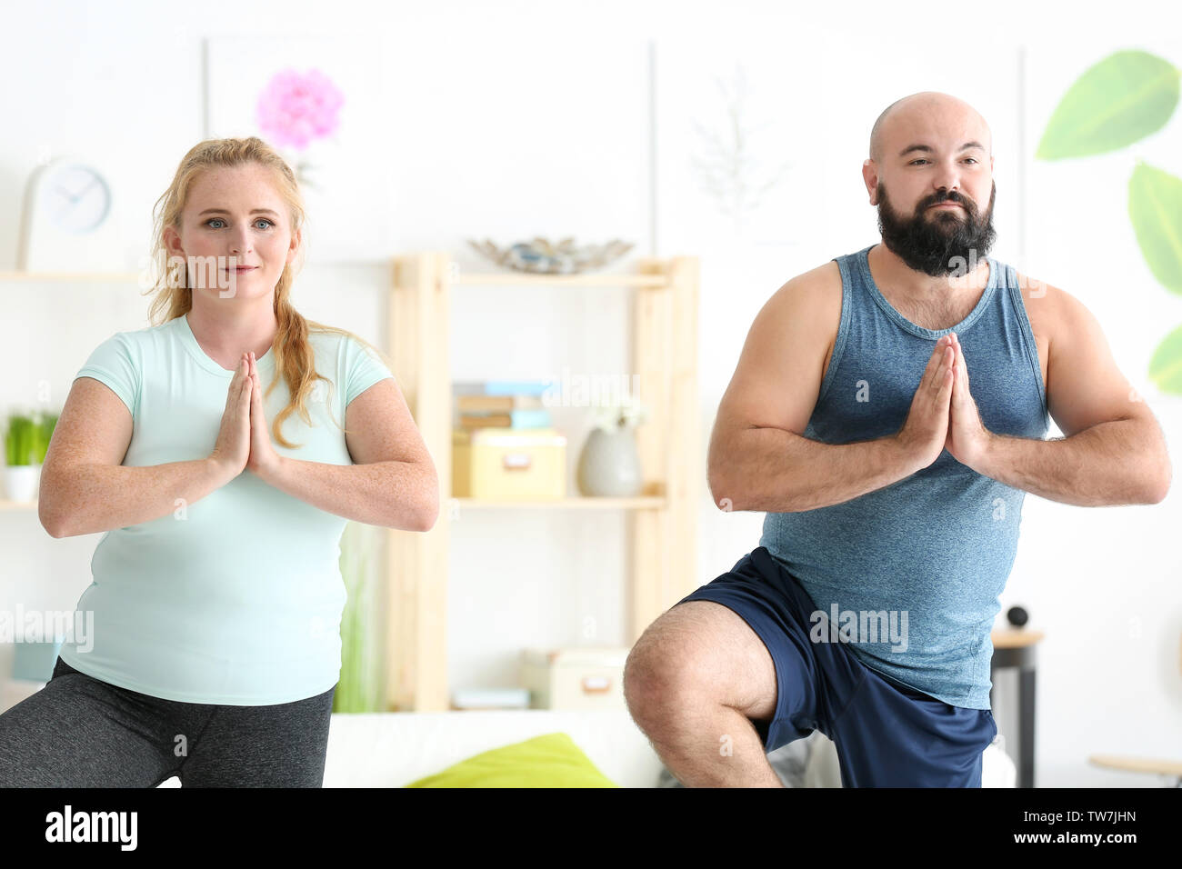 Overweight couple doing exercises hi-res stock photography and images ...