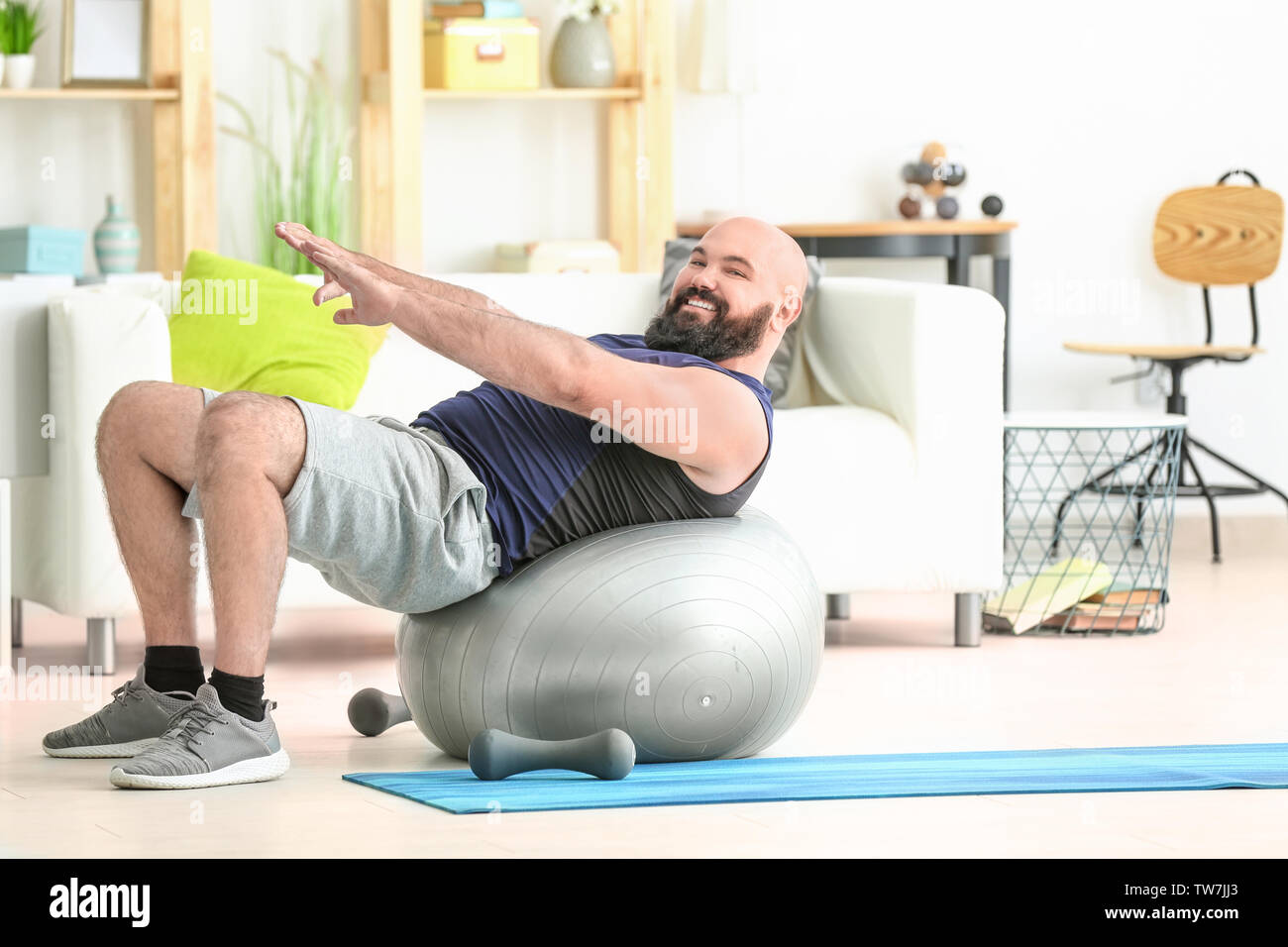 Fat man doing exercises hi-res stock photography and images - Alamy