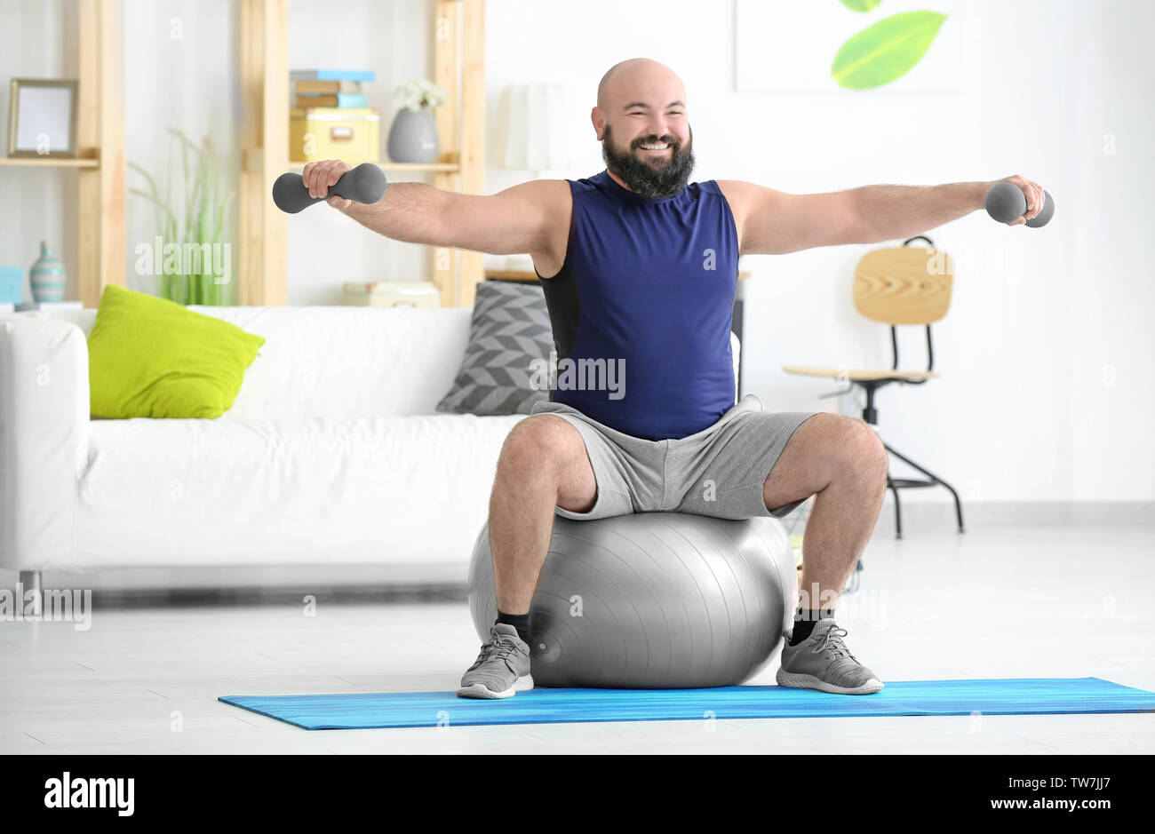 Overweight man doing exercises hi-res stock photography and images - Alamy