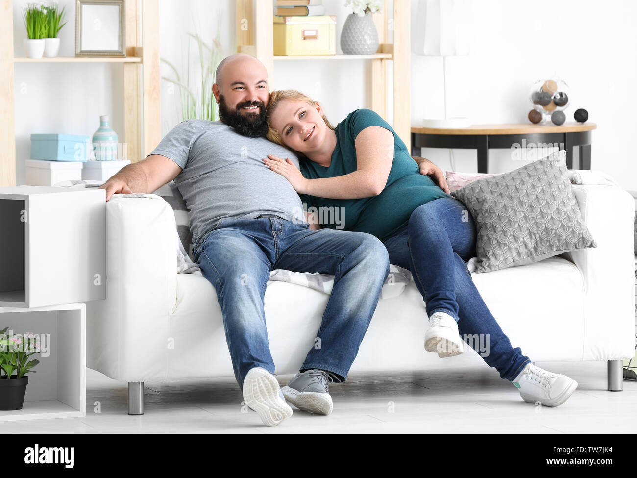 Obese man watching tv hi-res stock photography and images - Alamy