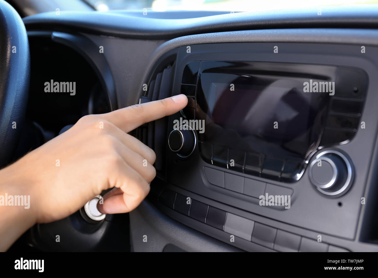 Man tuning car radio, closeup Stock Photo - Alamy