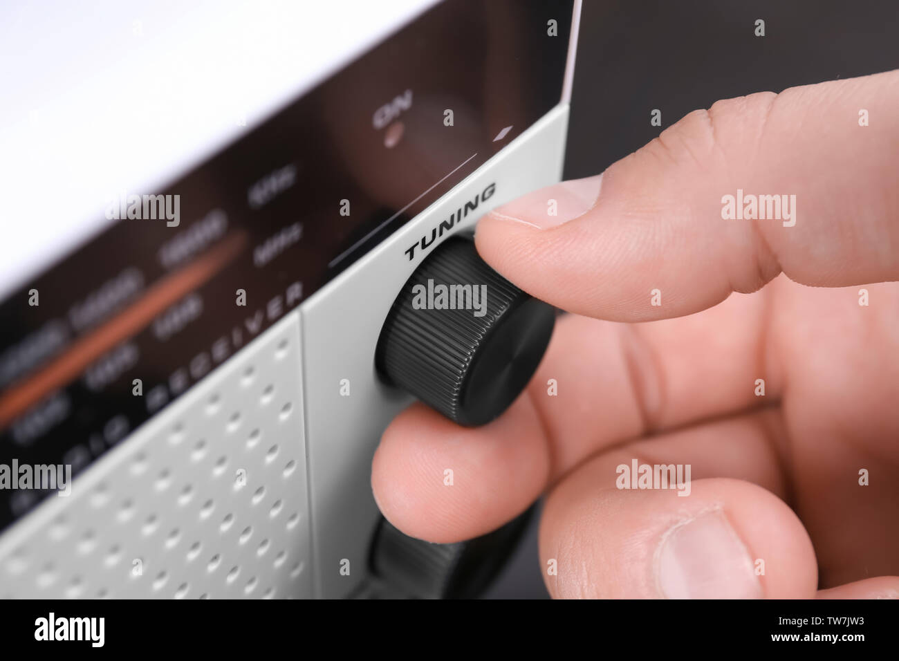 Person tuning white radio, closeup Stock Photo - Alamy