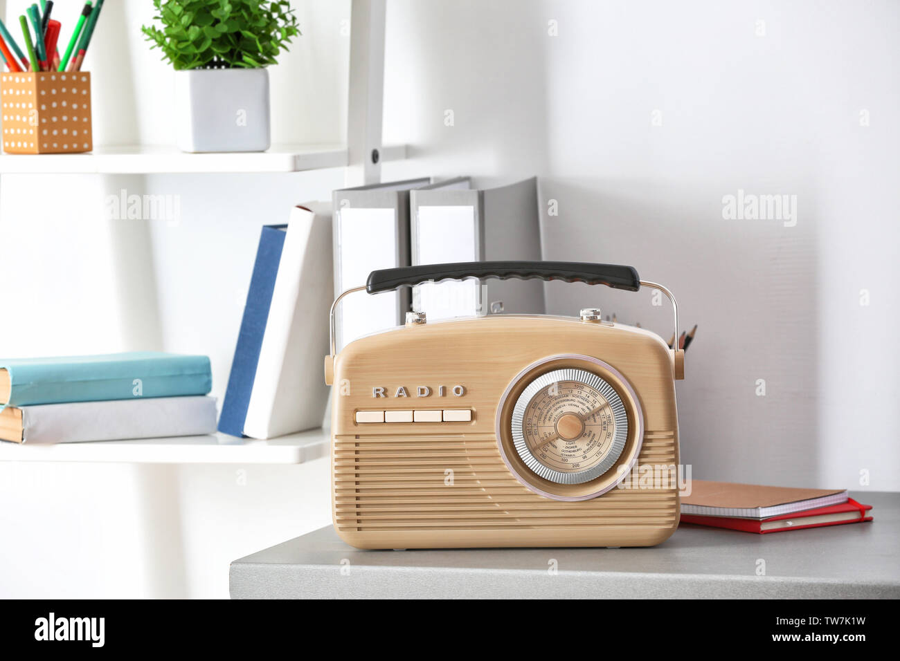 Retro radio on table in room Stock Photo - Alamy