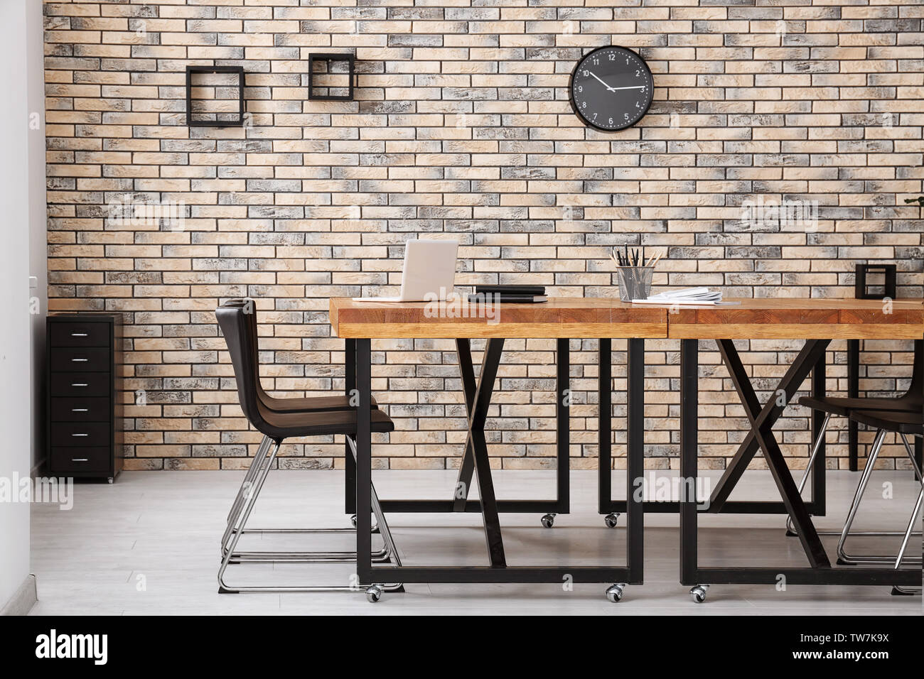 Modern office interior with wooden tables and chairs Stock Photo - Alamy