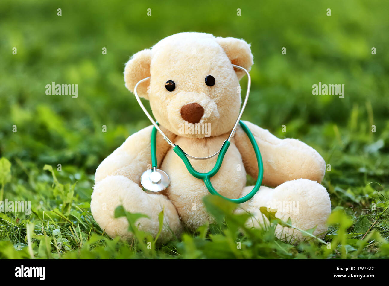 Teddy bear with stethoscope outdoors. Pediatrician concept Stock Photo ...