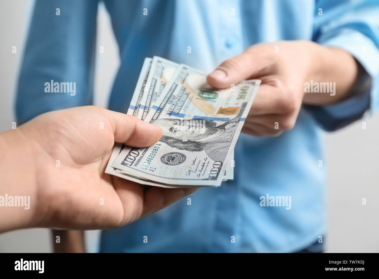 Women passing money, closeup Stock Photo - Alamy