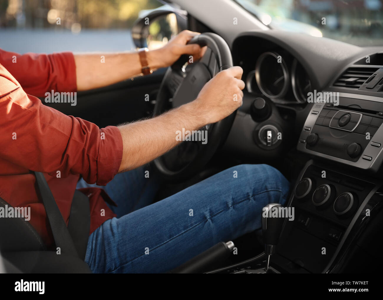 Man on driver seat of car Stock Photo - Alamy
