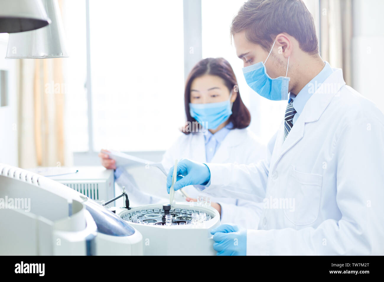 People do medical photography in lab Stock Photo - Alamy