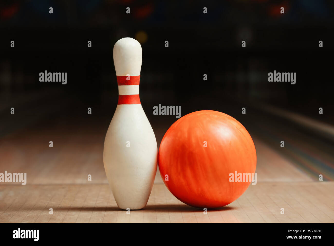 Pin and ball on floor in bowling club Stock Photo - Alamy