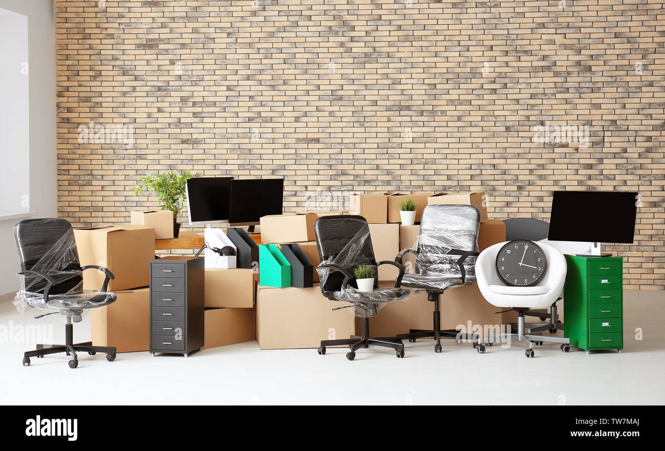 Carton boxes with stuff in empty room. Office move concept Stock Photo ...
