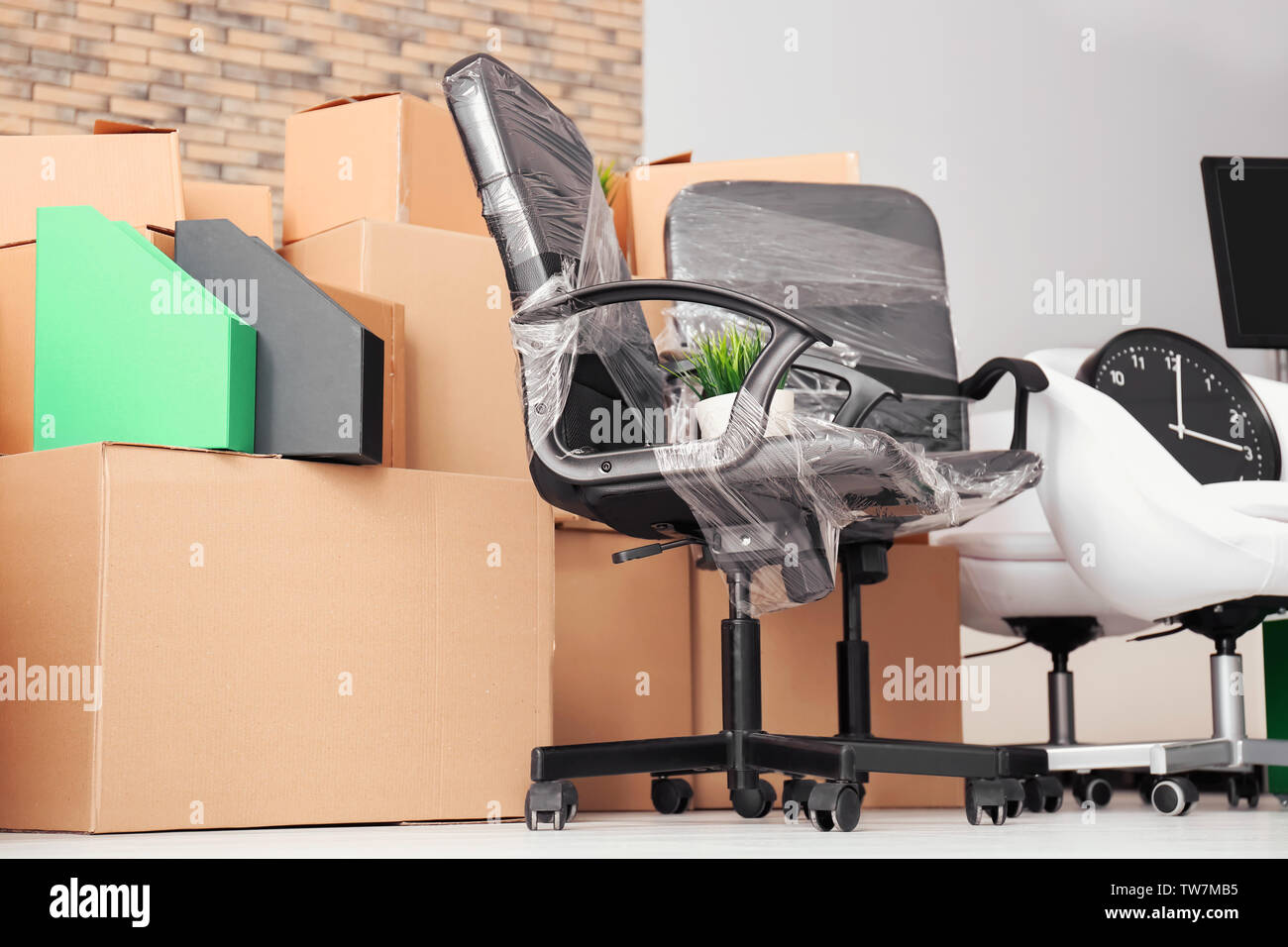 Carton boxes with stuff on floor in room. Office move concept Stock ...