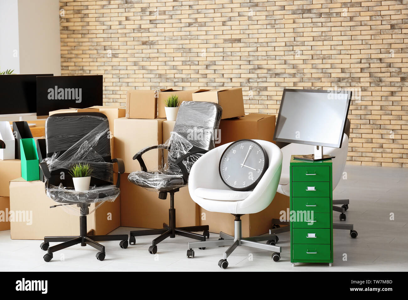 Carton boxes with stuff in empty room. Office move concept Stock Photo ...