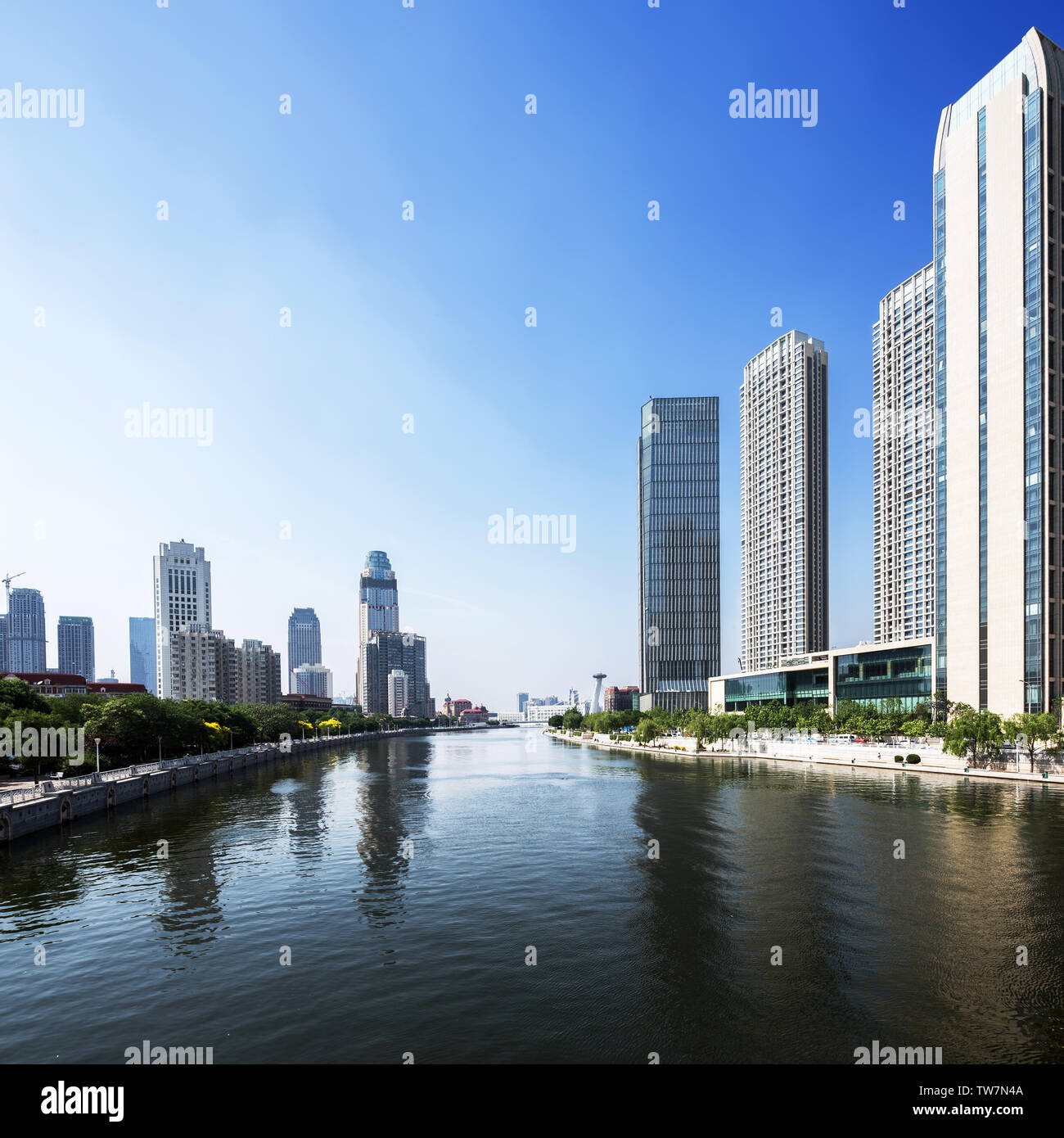modern buildings in urban city at riverbank Stock Photo - Alamy