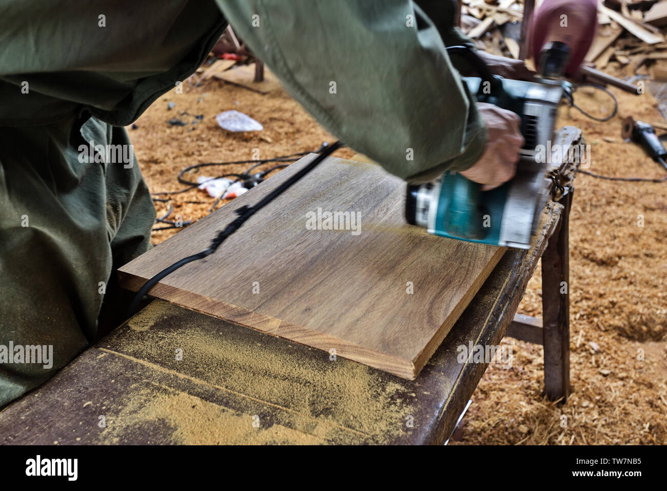 Hands of a carpenter planed wood Stock Photo - Alamy