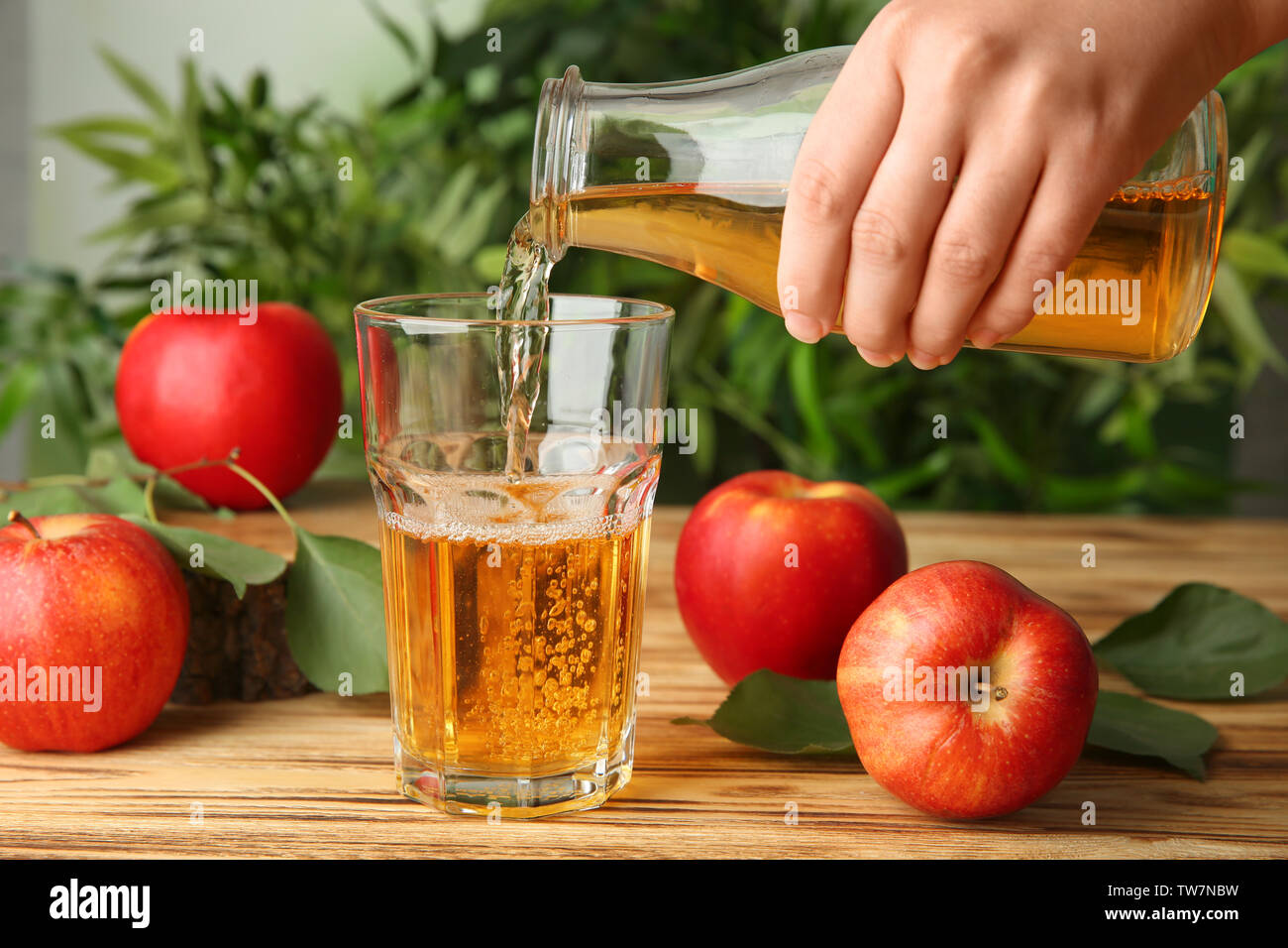 Woman pouring apple juice hi-res stock photography and images - Alamy