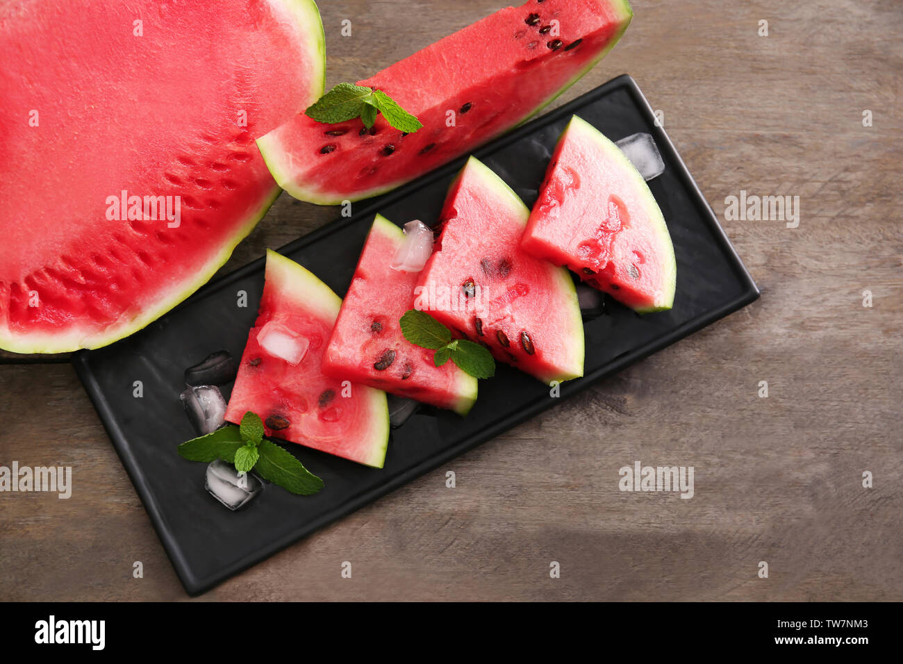 Tasty sliced watermelon on table Stock Photo - Alamy
