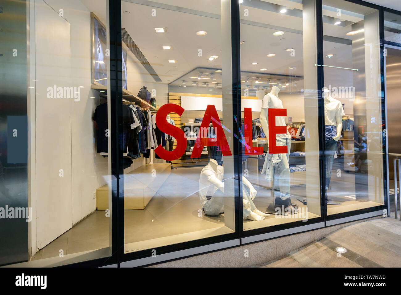Sale word on shopfront display window Stock Photo - Alamy