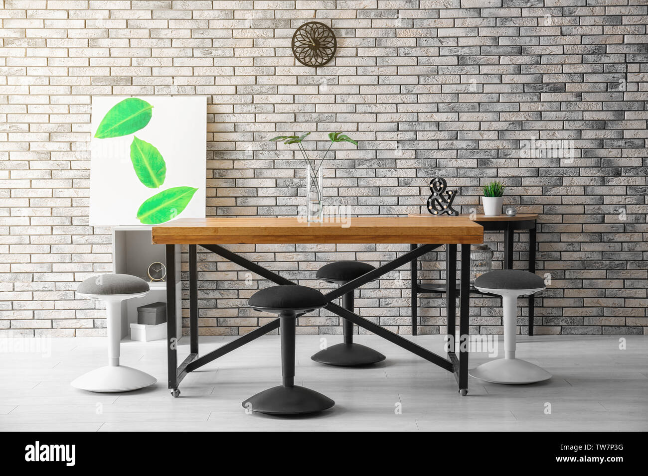 Modern room interior with table and stools Stock Photo - Alamy