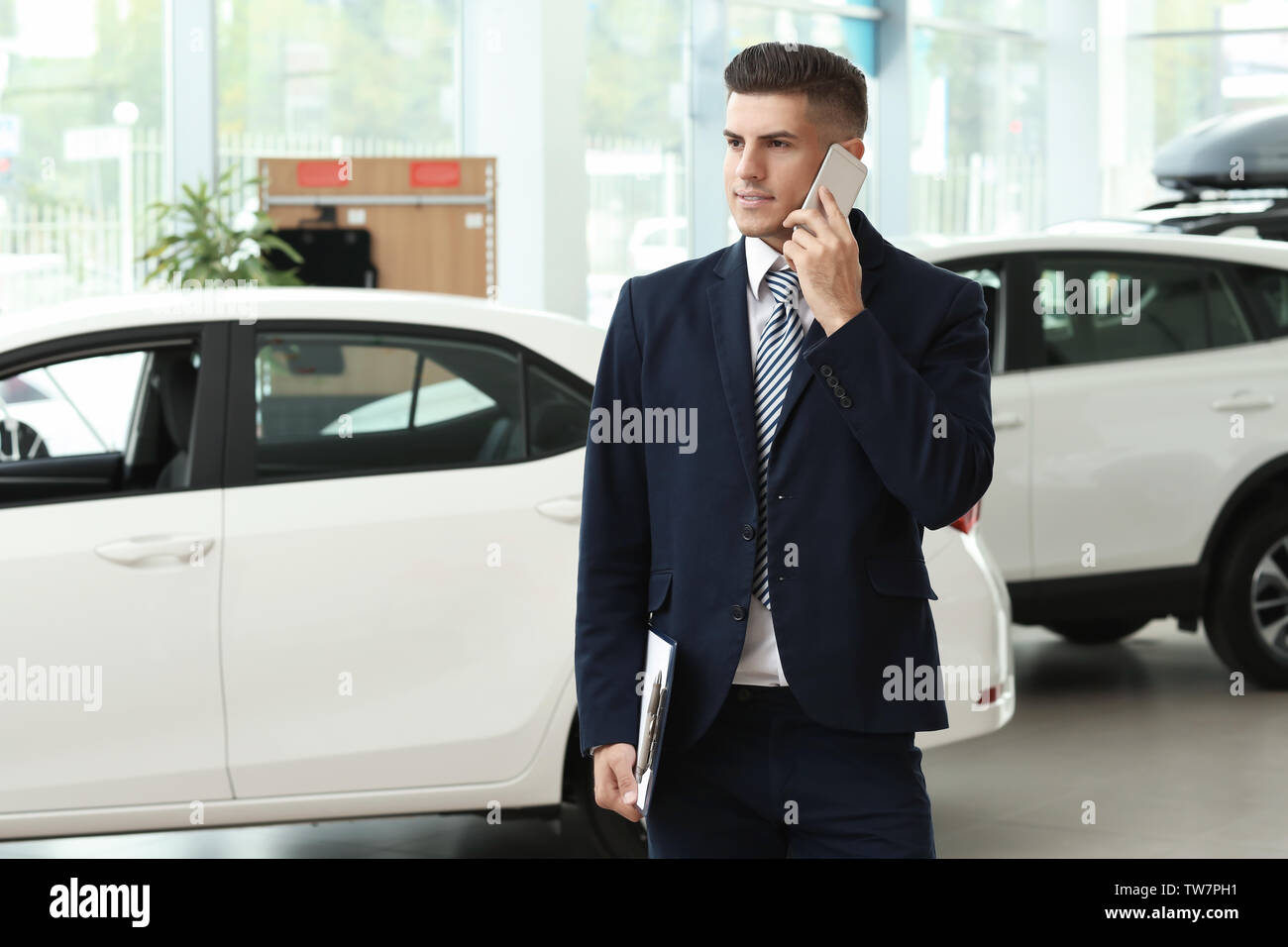Man and salesman talking in shop hi-res stock photography and images ...