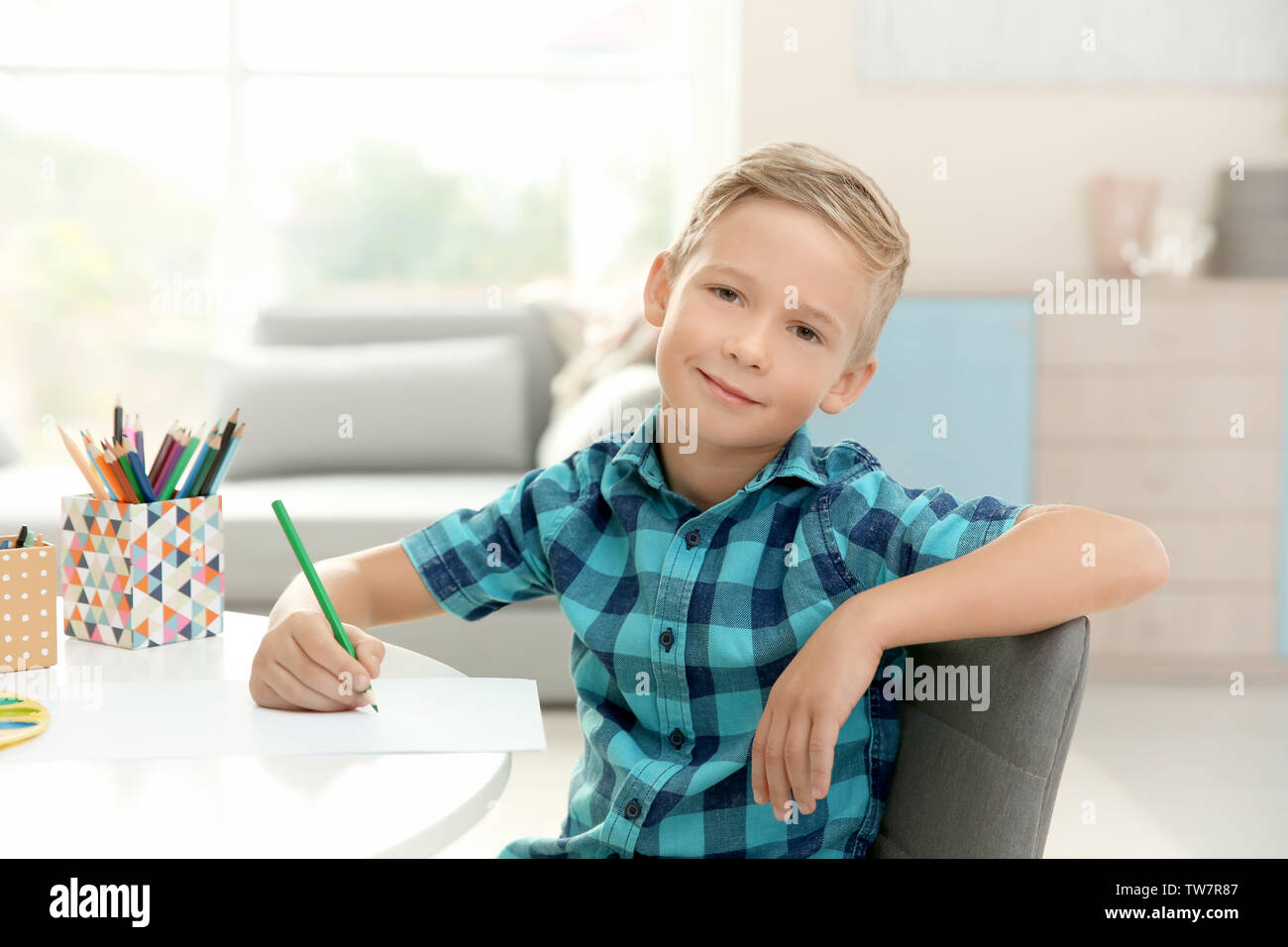Cute little boy drawing at home Stock Photo - Alamy