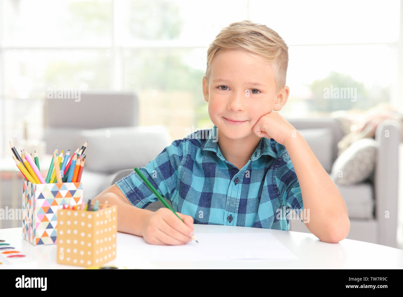Cute little boy drawing at home Stock Photo - Alamy