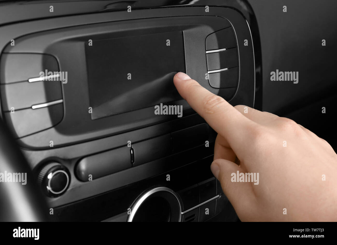 Man tuning radio in car Stock Photo - Alamy