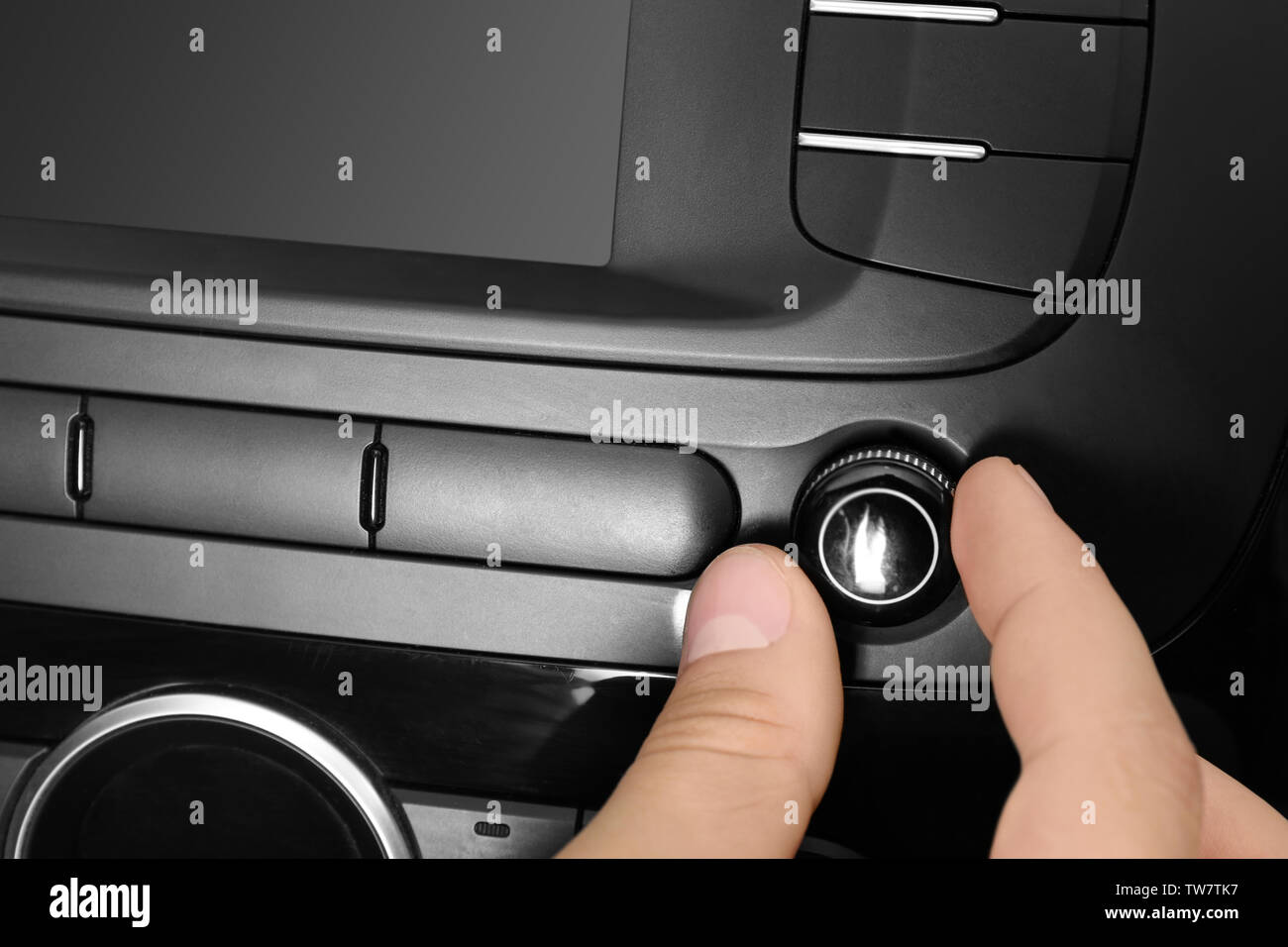 Man tuning radio in car Stock Photo - Alamy