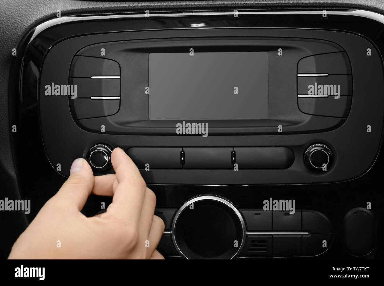 Man tuning radio in car Stock Photo - Alamy