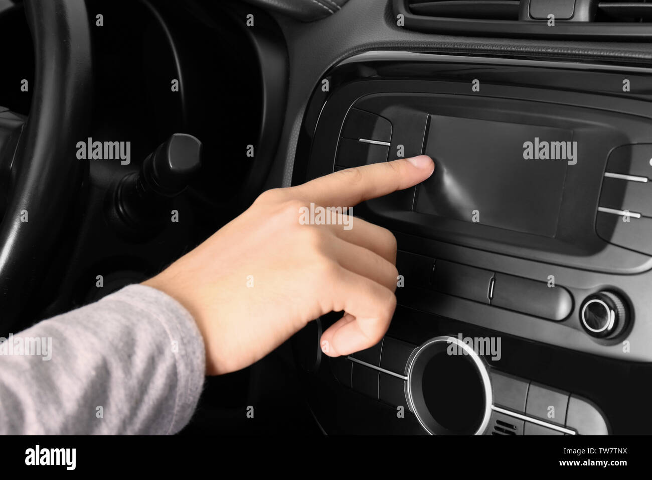 Man tuning radio in car Stock Photo - Alamy