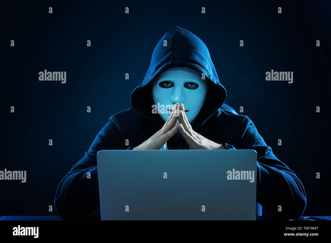 Hacker anonymous mask using laptop hi-res stock photography and images ...