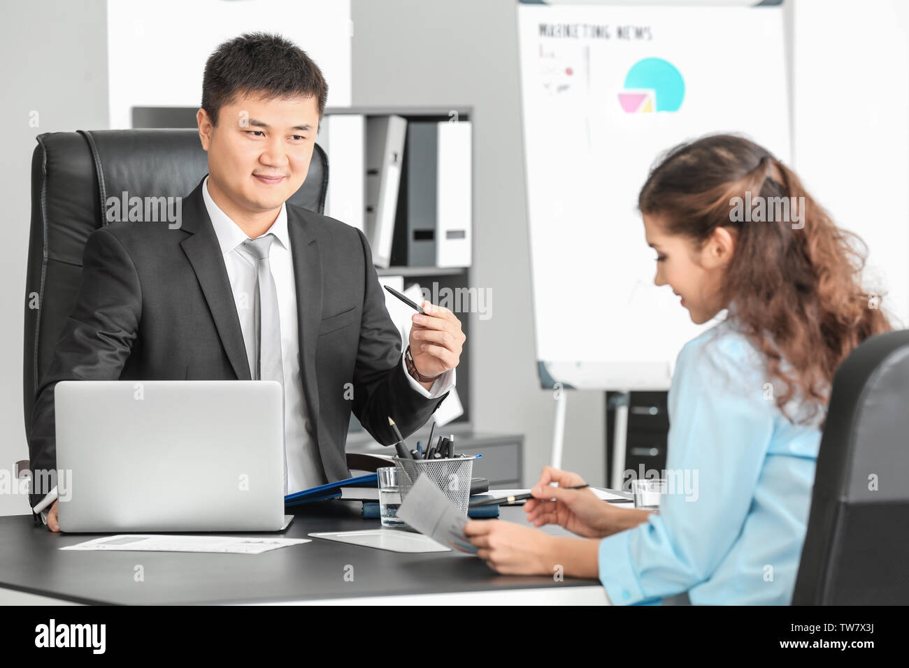Young managers working in office Stock Photo - Alamy