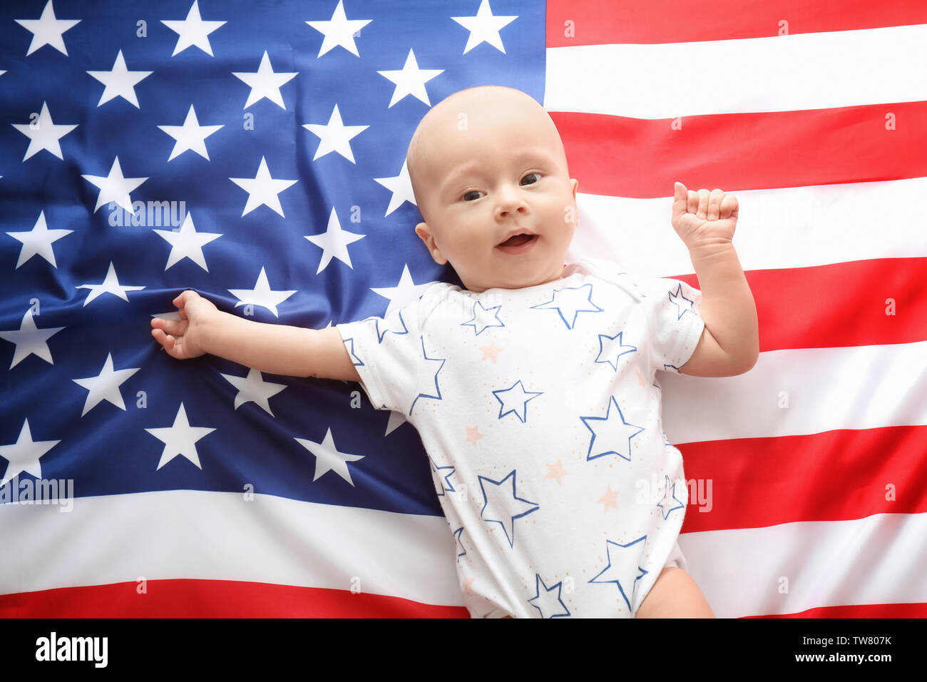 Cute baby on American flag background Stock Photo - Alamy