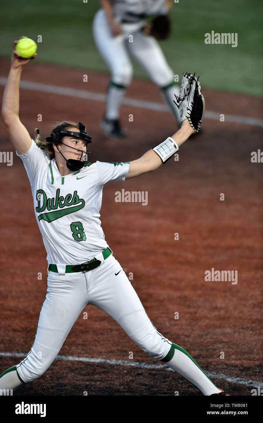 Pitcher in the circle in the wind up prior to releasing a pitch to a ...
