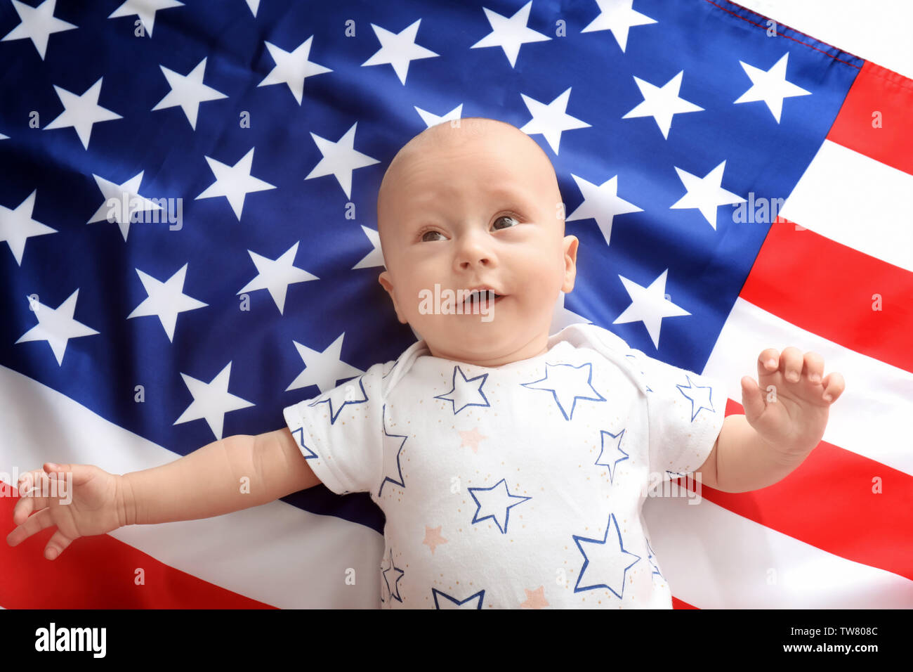 Cute baby on American flag background Stock Photo - Alamy