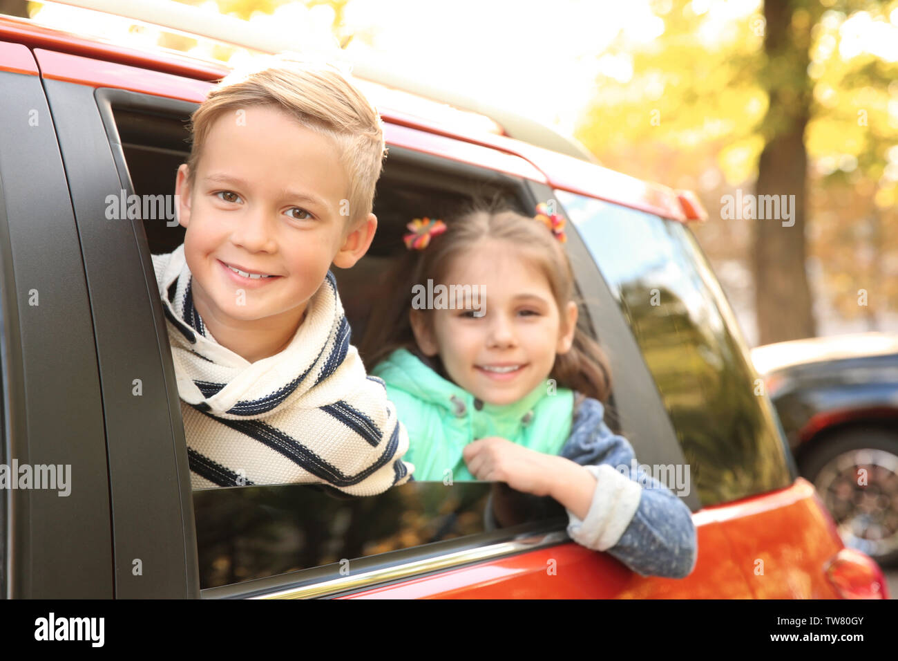 Cute children in car Stock Photo - Alamy
