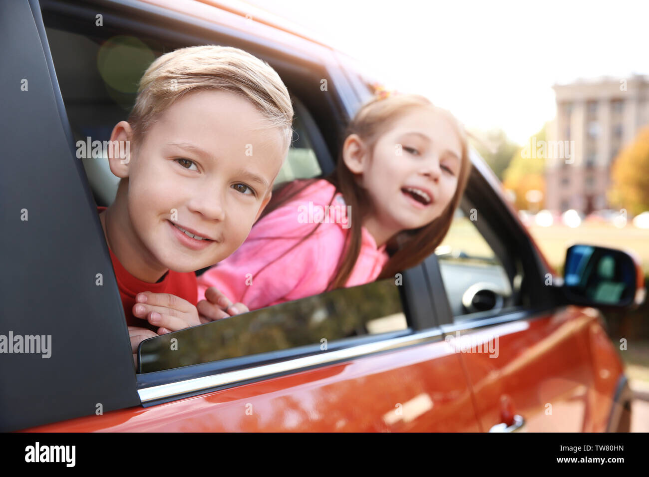 Cute children sitting in car Stock Photo - Alamy