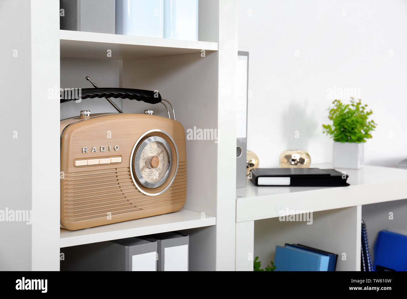 Modern radio on shelf in room Stock Photo - Alamy
