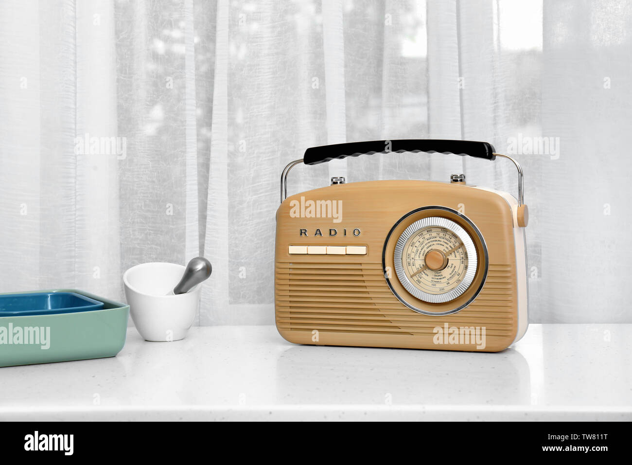 Modern radio on table in kitchen Stock Photo - Alamy